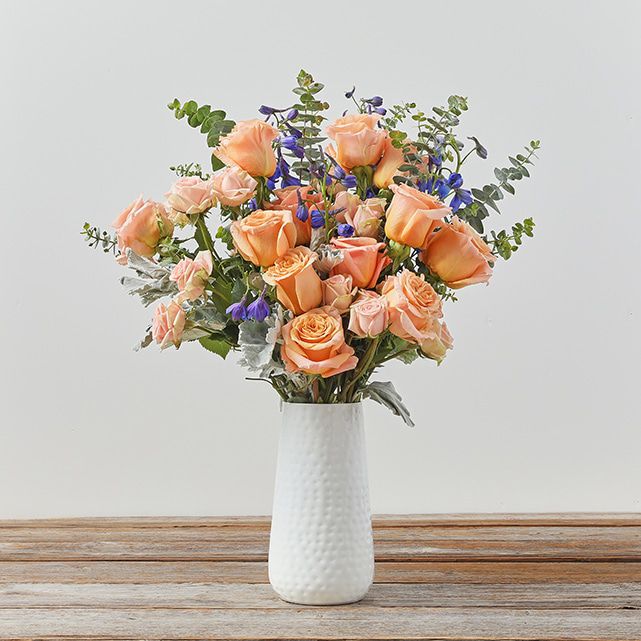 Blue Delphinium + Peach Roses - The Bouqs Co.