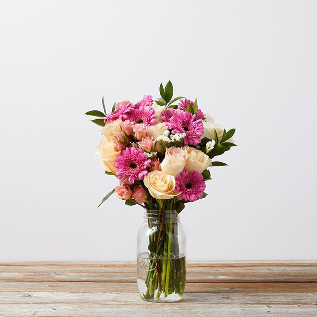 Pink Mini Gerberas with Cream or Peach Roses - The Bouqs Co.
