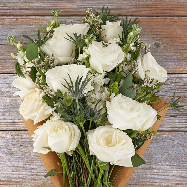 Mixed Bouquet of White Roses and Blue Thistle - The Bouqs Co.